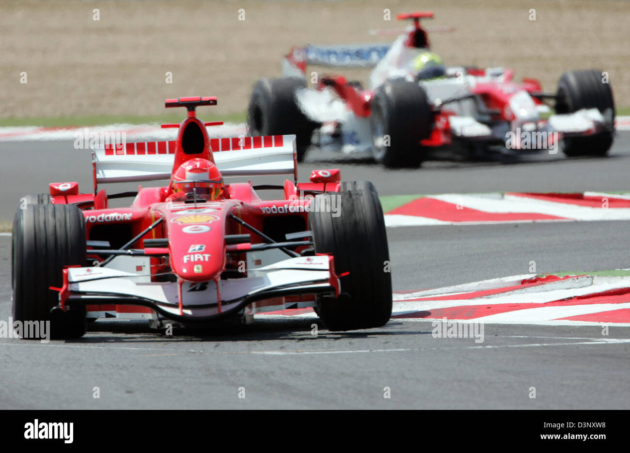 German Formula One pilot Michael Schumacher (front) of Scuderia Ferrari ...