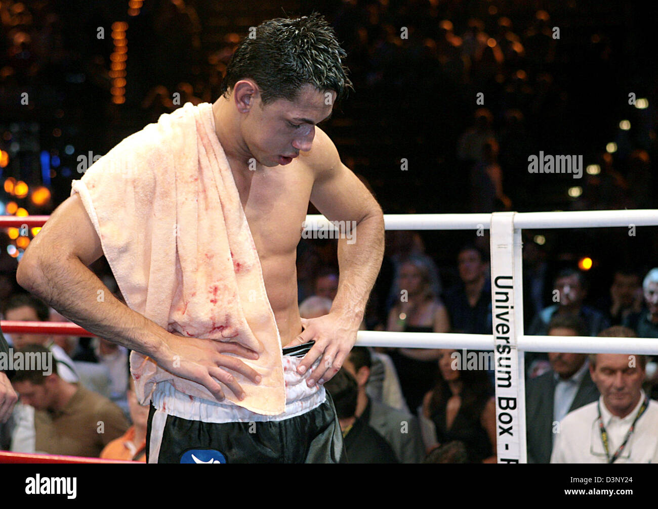 German professional boxer Felix Sturm stands in the ring disappointedly ...