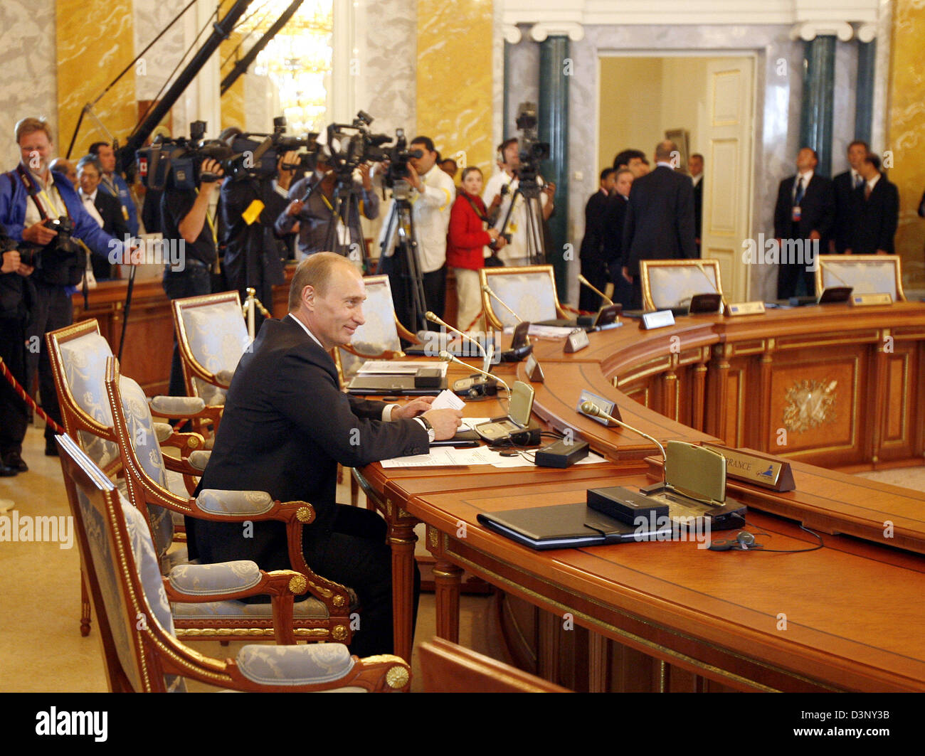 Russian President Vladimir Putin is first to take a seat at the ...
