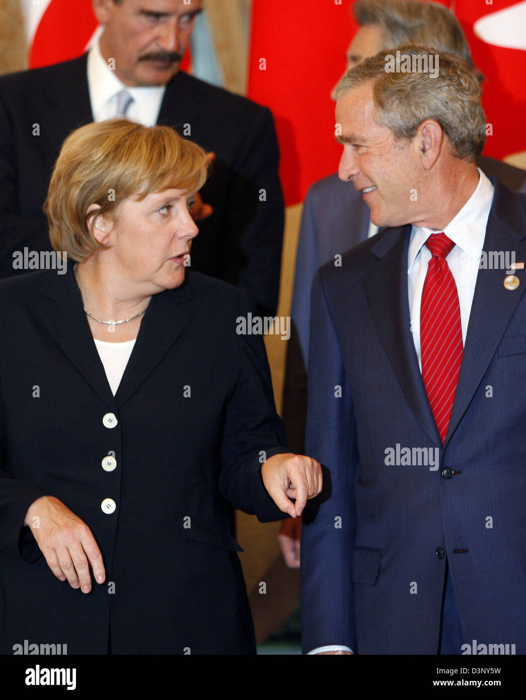 German Chancellor Merkel talks with US President Bush during the photo ...