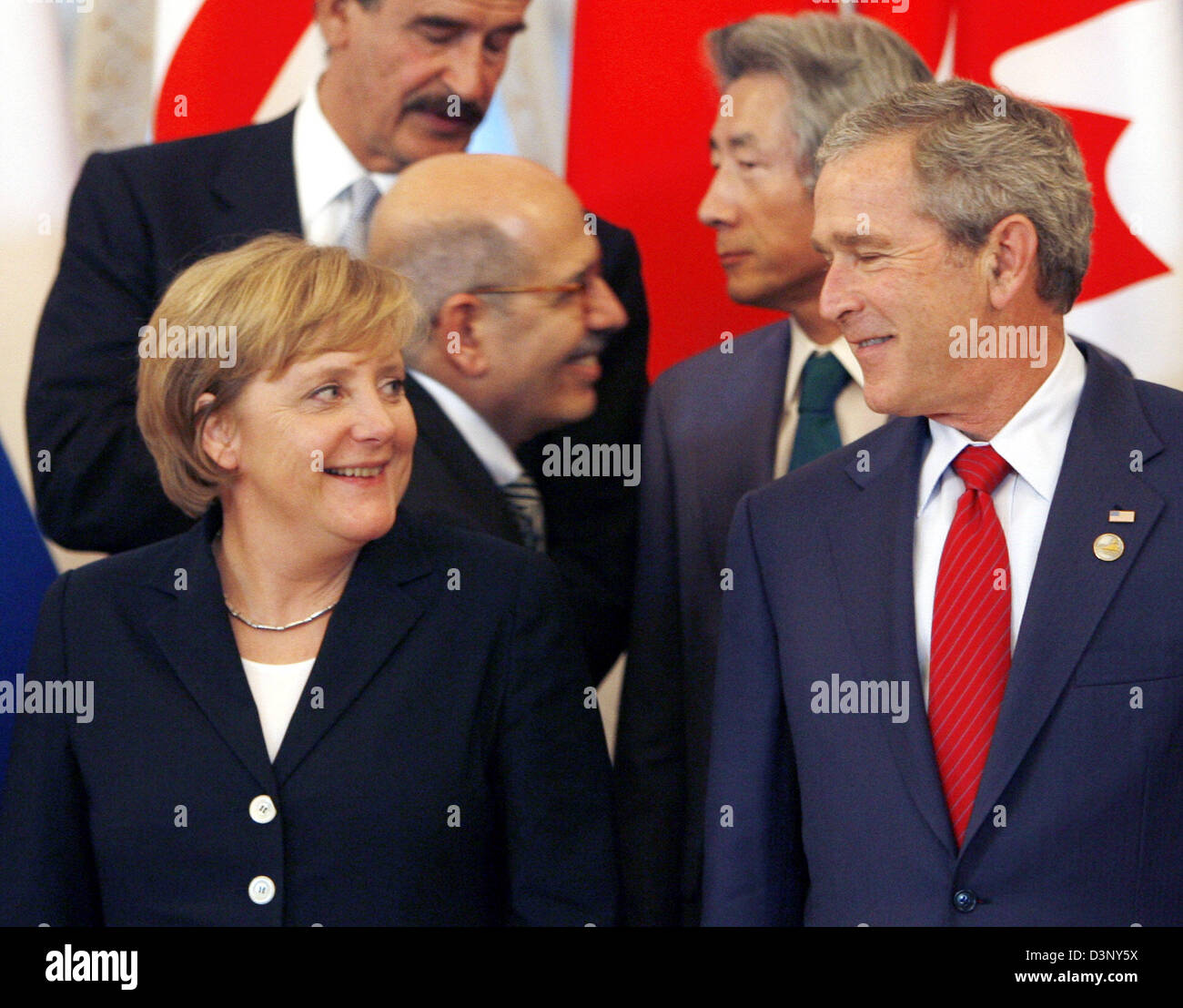 German Chancellor Merkel talks with US President Bush during the photo ...
