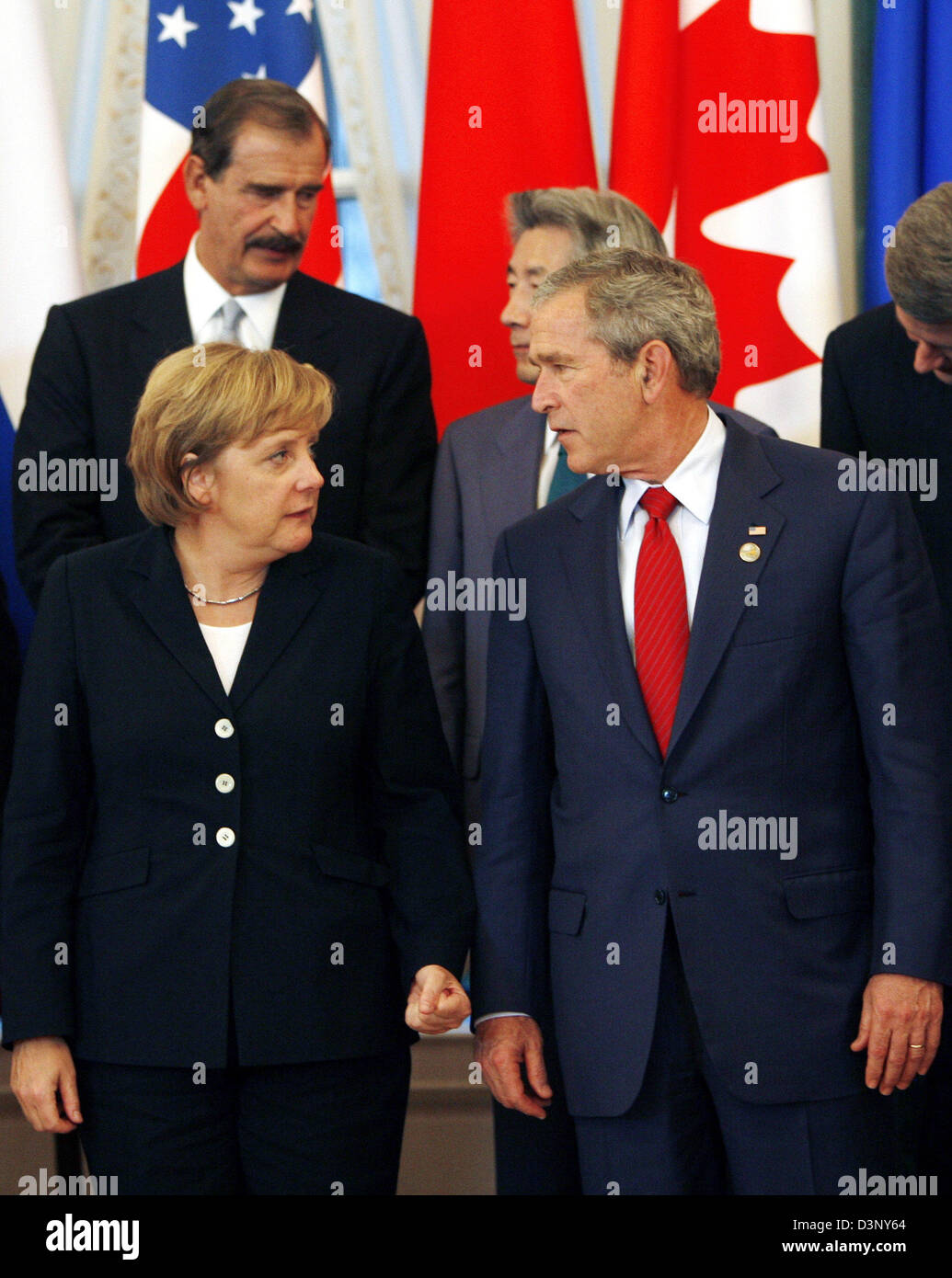 German Chancellor Merkel talks with US President Bush during the photo ...