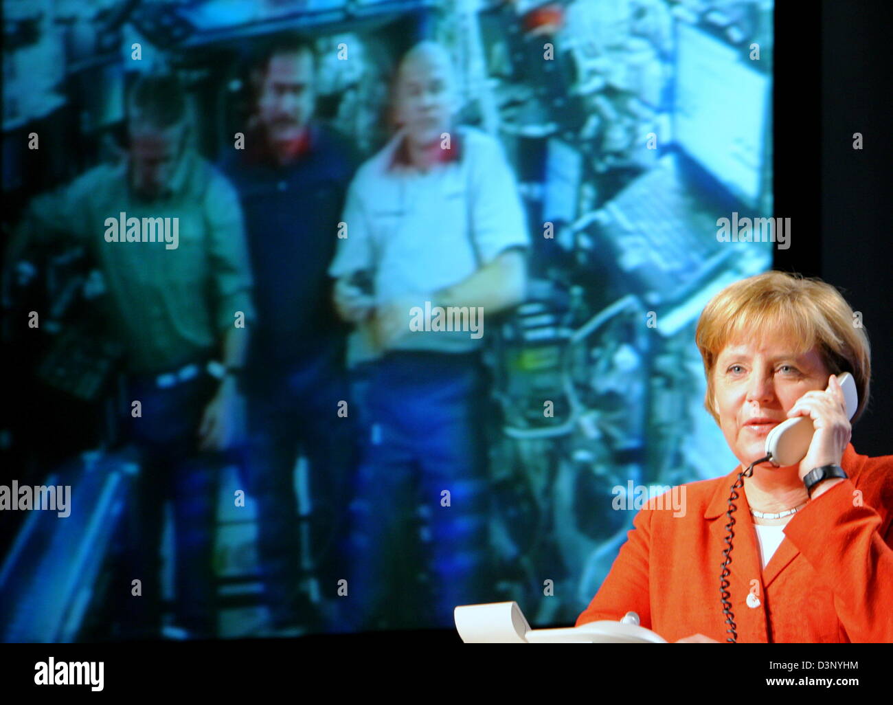 German Chancellor Angela Merkel (R) talks to German astronaut Thomas ...