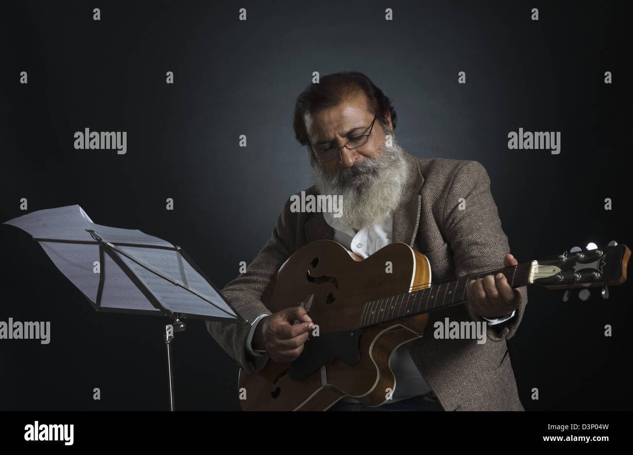 Guitarist performing in a musical concert Stock Photo - Alamy