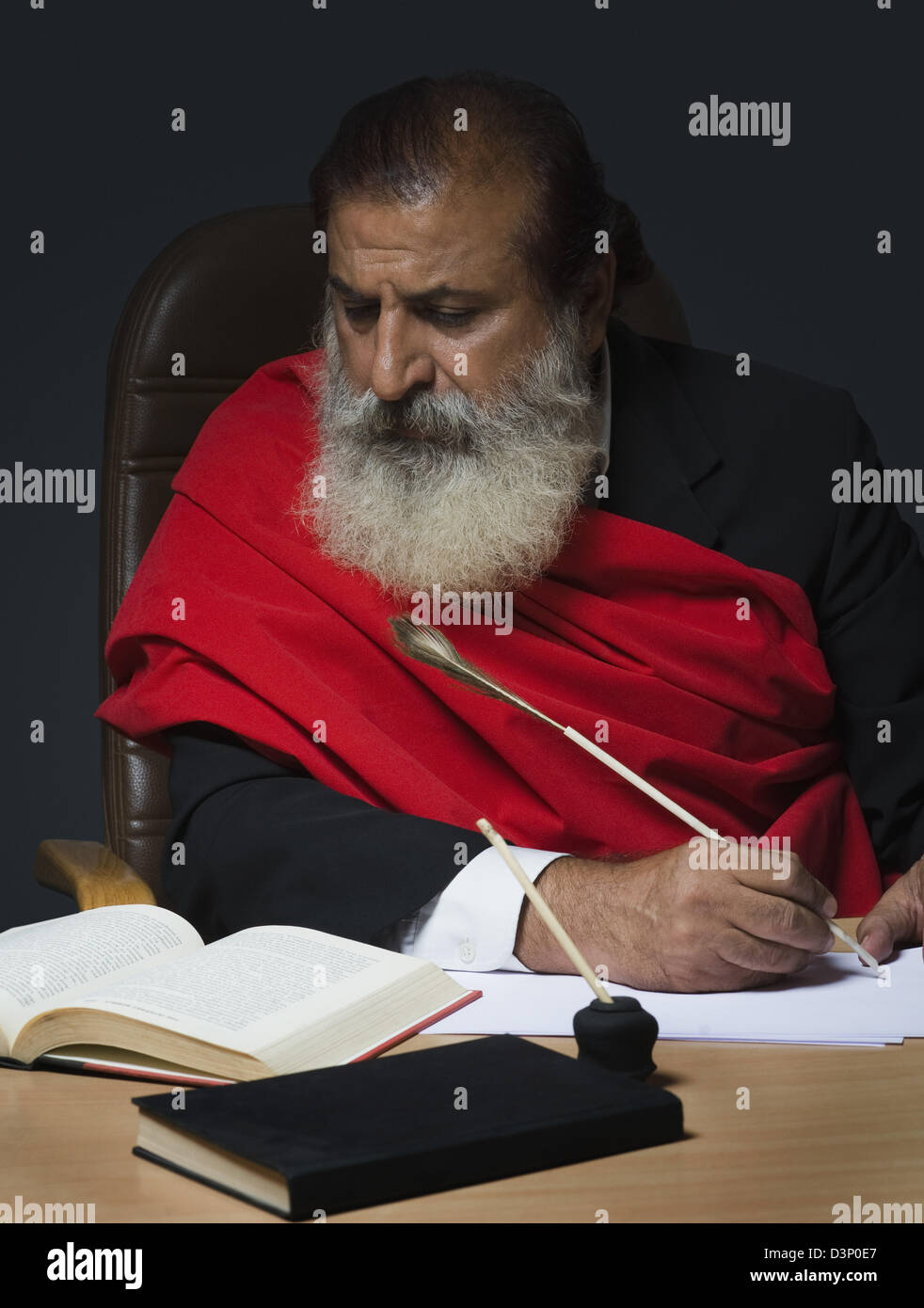 Critic writing review on a book Stock Photo - Alamy