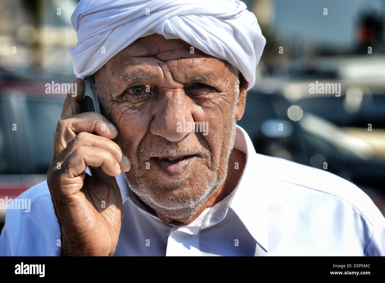 An elderly man with his mobile phone in Sharjah in Sharjah City Stock ...
