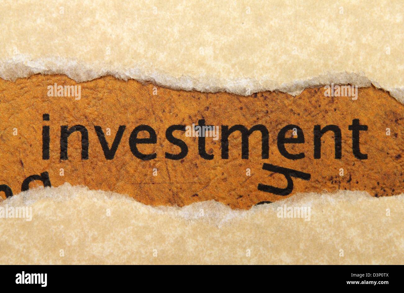 Investment text on grunge paper Stock Photo - Alamy