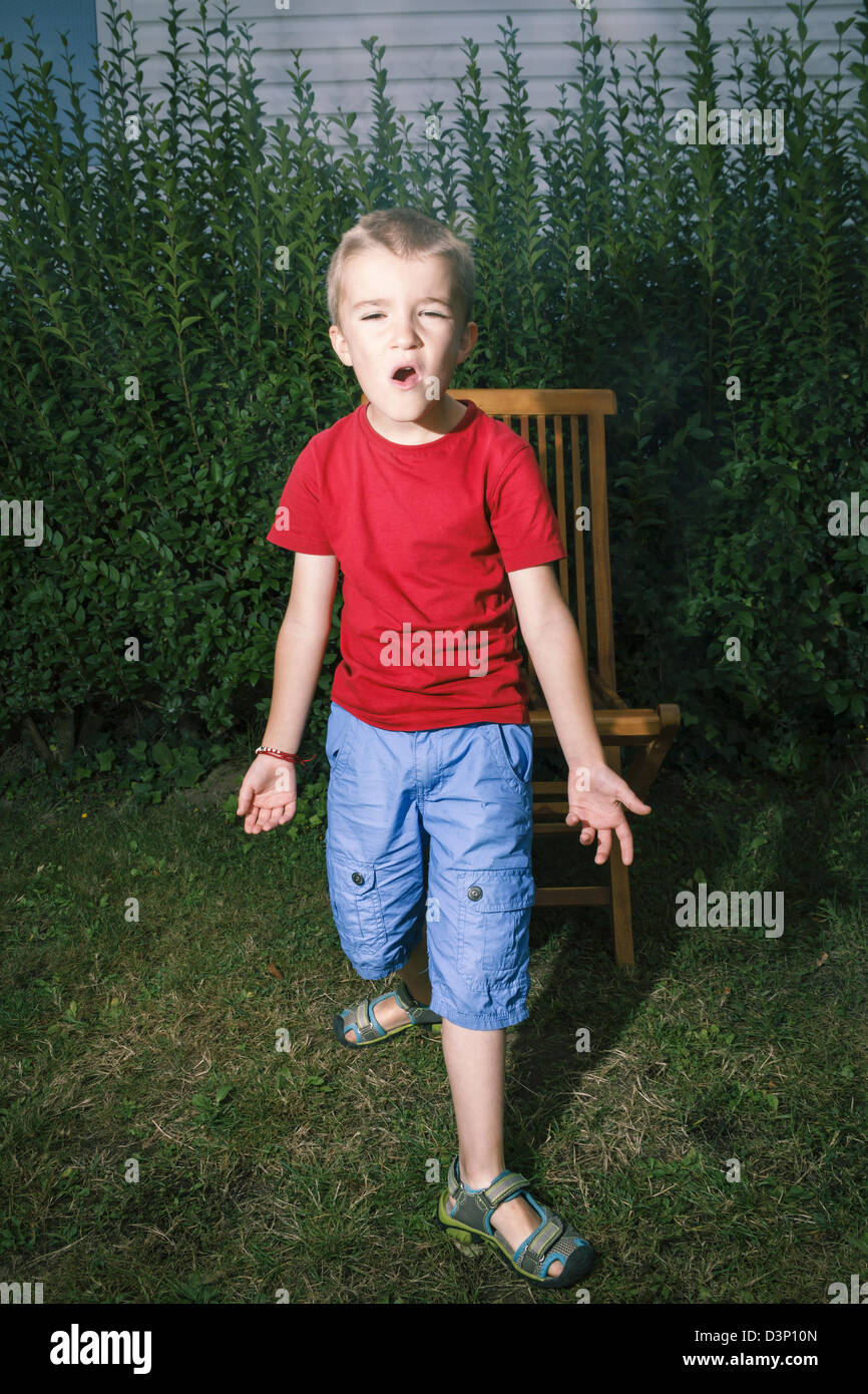Portrait of boy (6-7) gesturing Stock Photo - Alamy