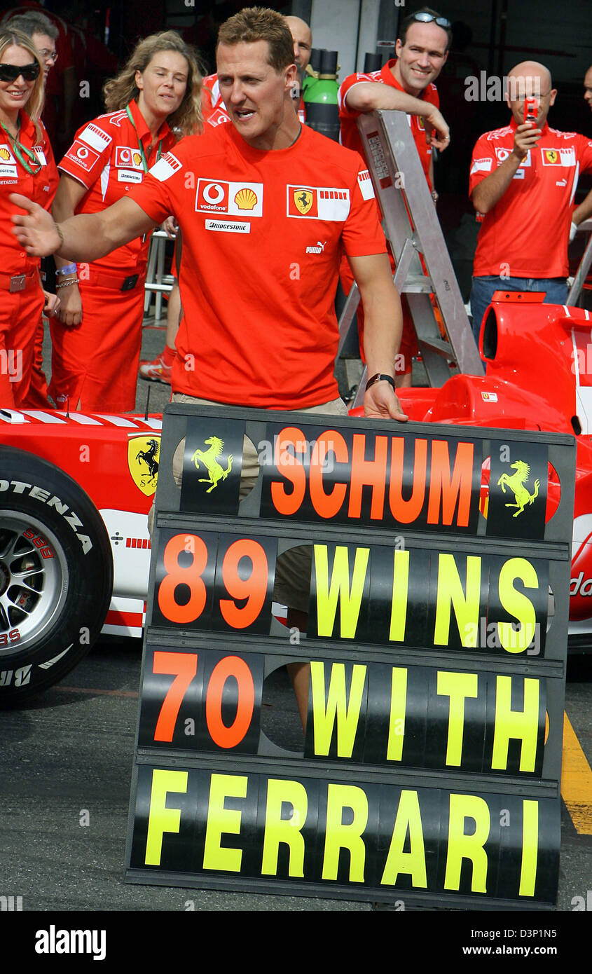 German Formula One driver Michael Schumacher celebrates after his ...