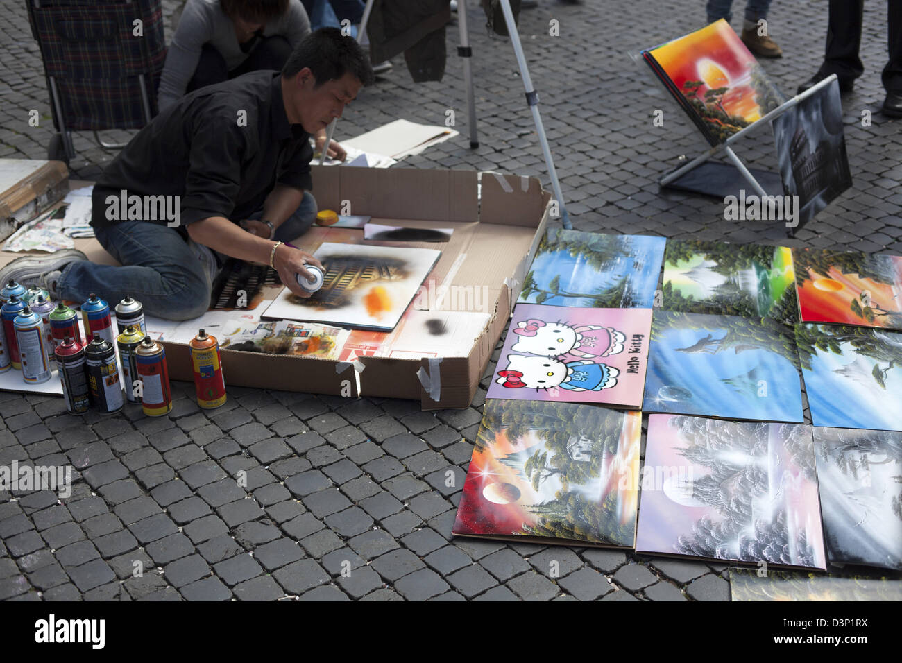 An artist at work with spray can paint in the Piazza Navona in Rome ...