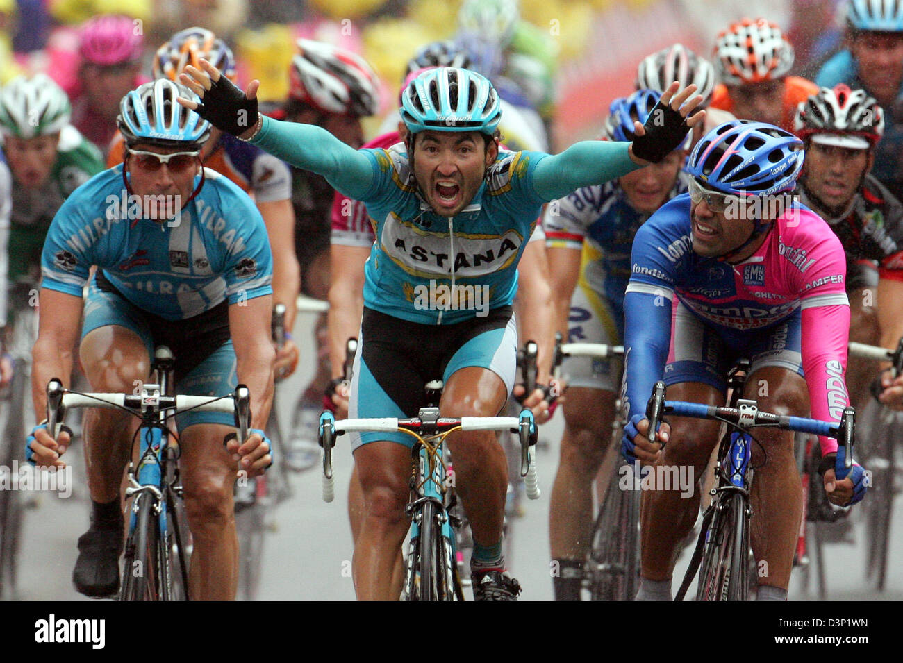 Kazakh cycling pro Assan Bazajev (C) of team Astana cheers after his ...