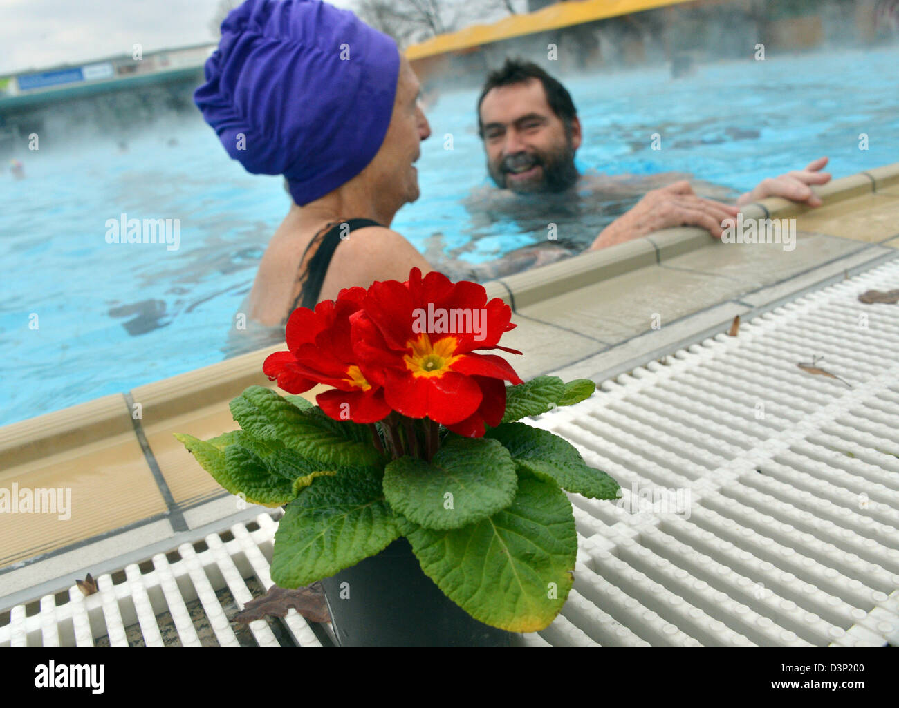 People take a bath in the swimming pool during temperatures below zero ...