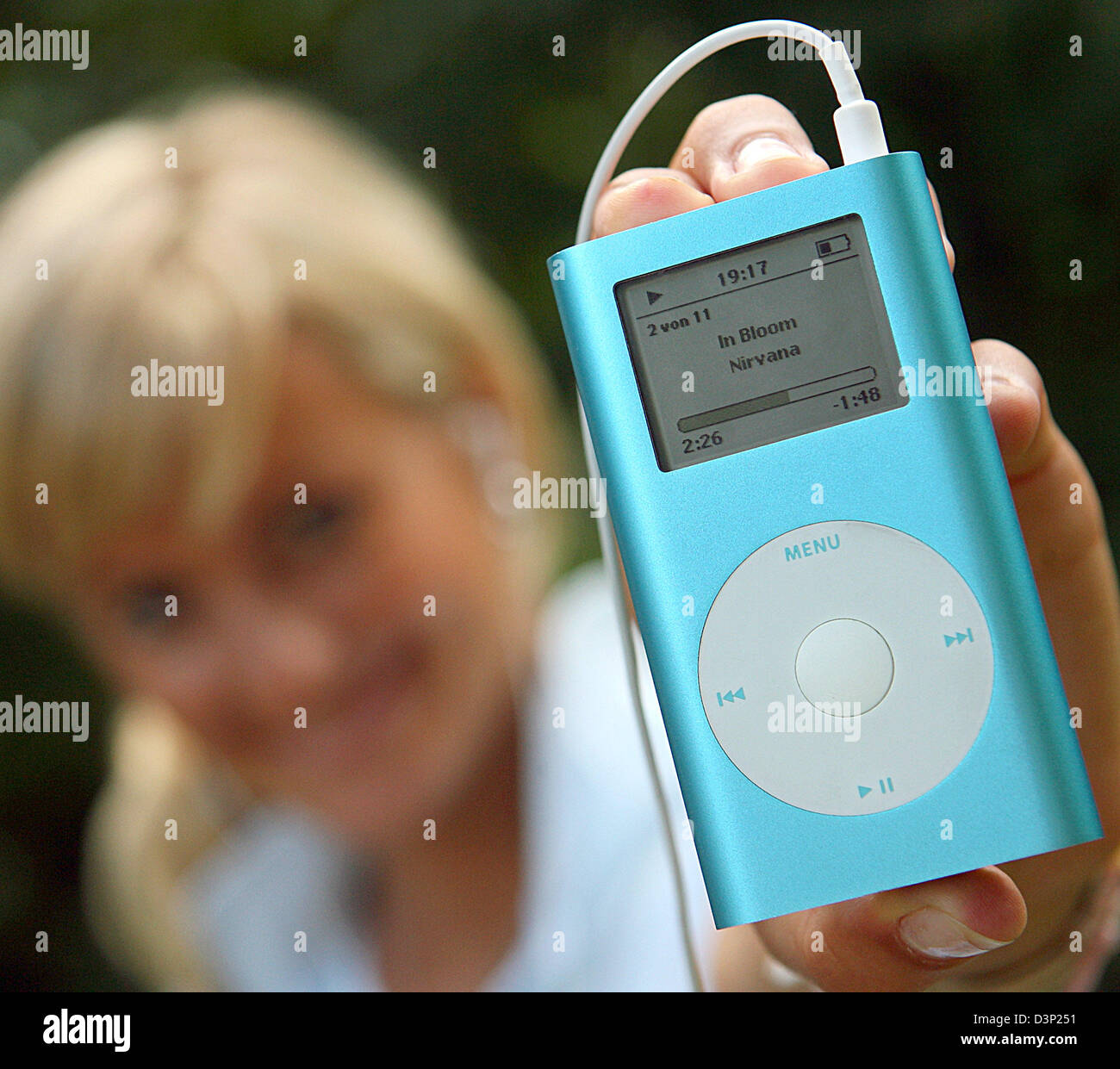 Viktoria is happy to listen to music on her Apple iPod mini in Bonn ...