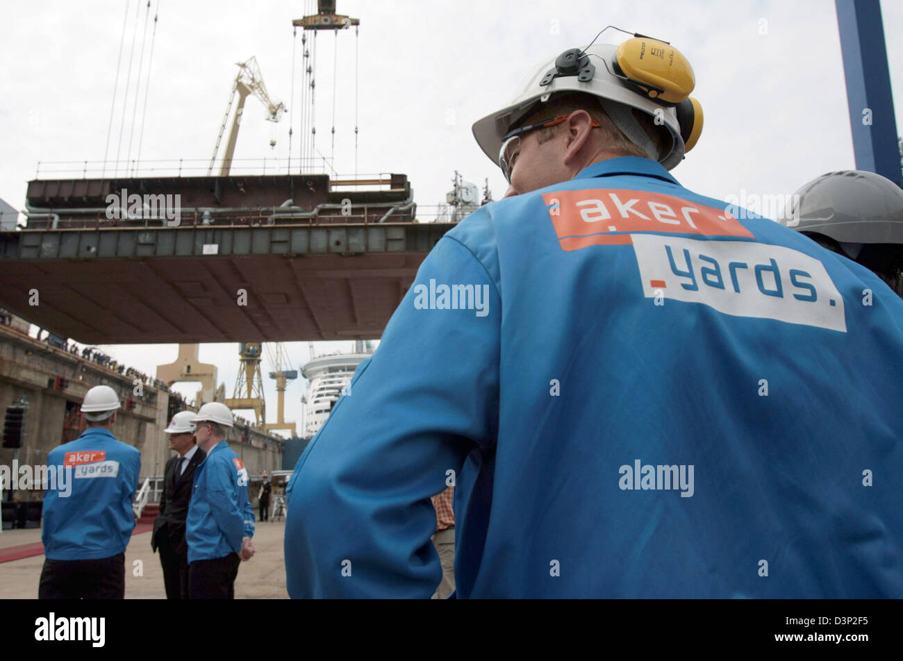 A staff member of the Aker Yards shipyard looks to the 'Color Magic' in ...