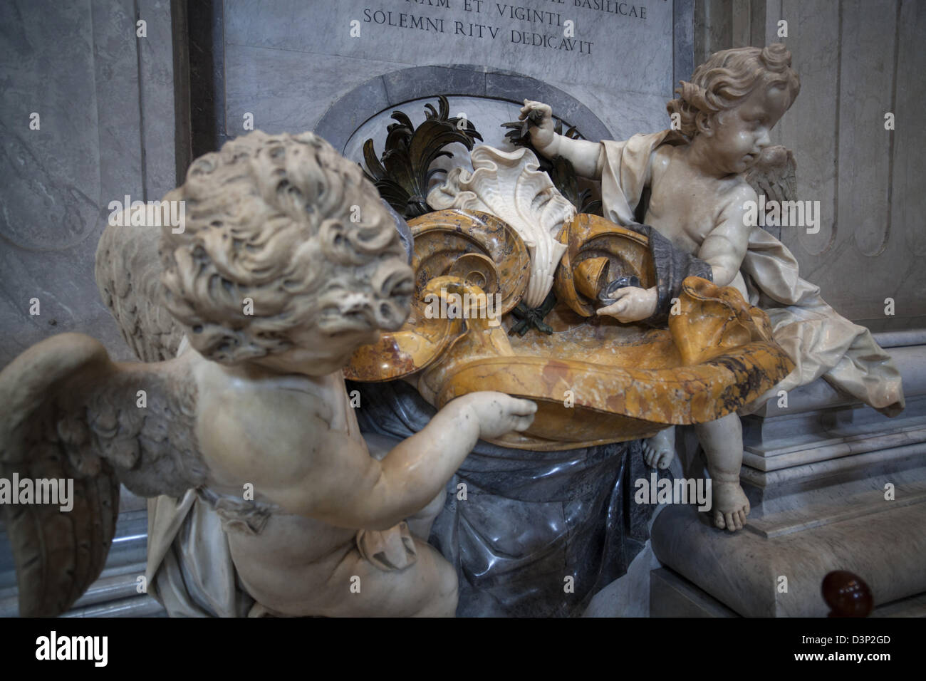 An elaborate font or stoup containing holy waterin St Peter's basilica ...