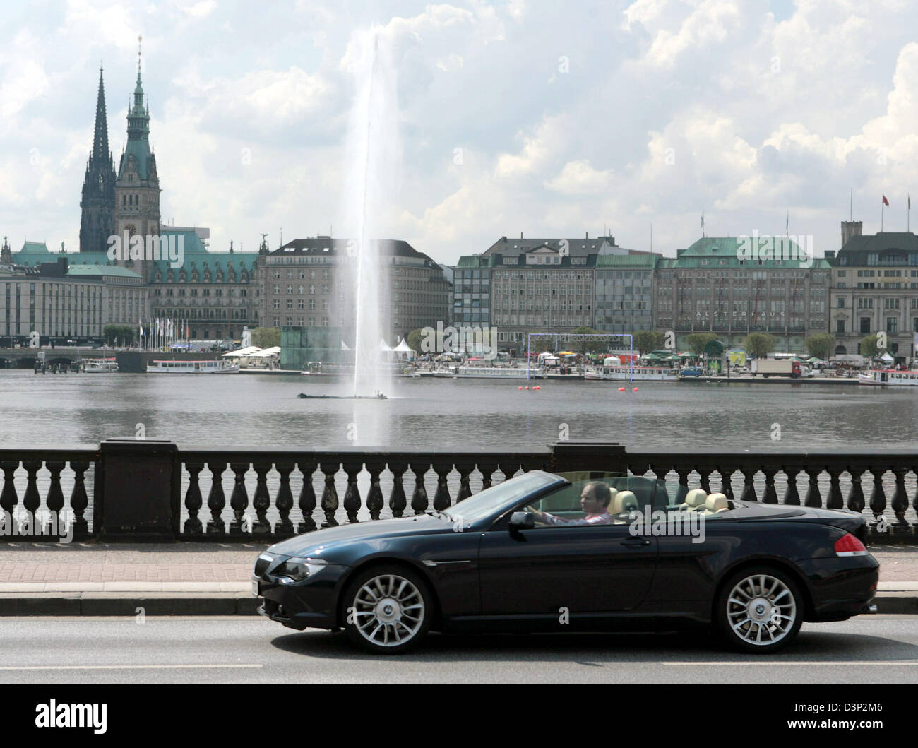 A convertible drives on the the Lombards bridge in Hamburg, Germany ...