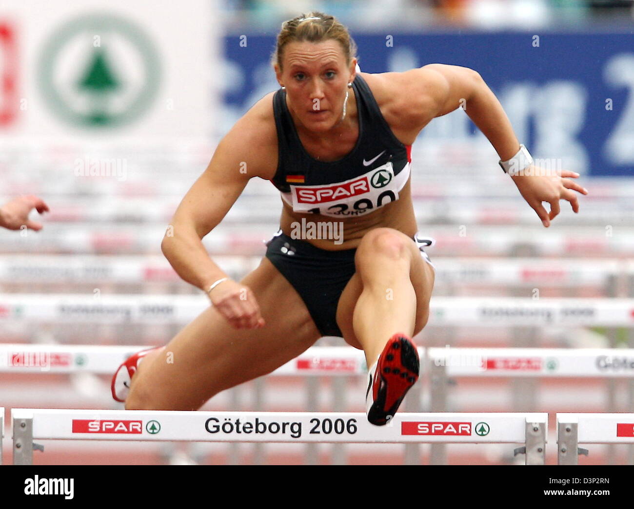 German athlete Kirsten Bolm flies over a hurdle at the 100m Hurdles ...