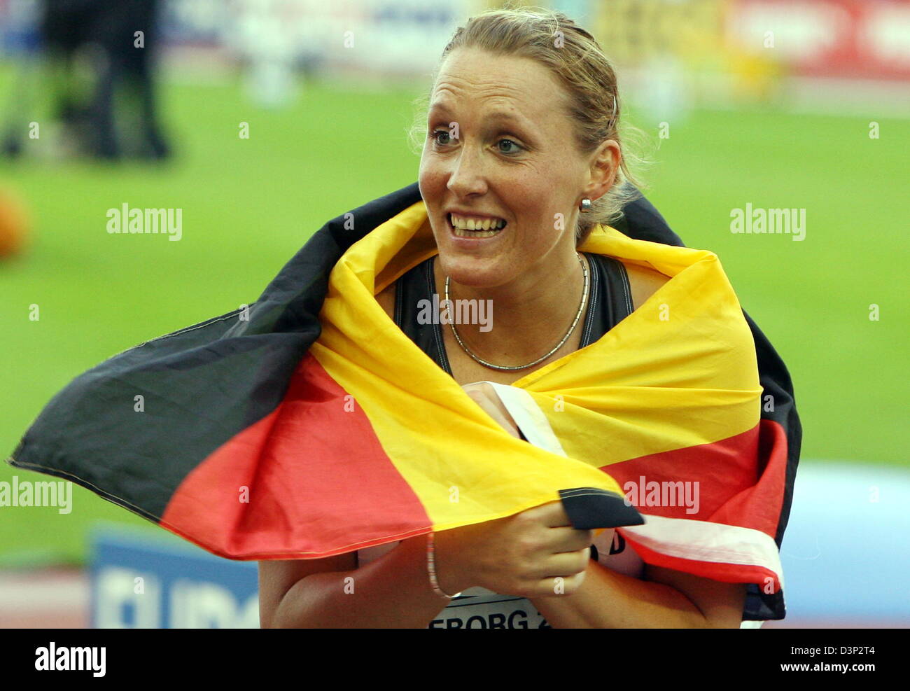 German athlete Kirsten Bolm cheers her third place in the 100m Hurdles ...