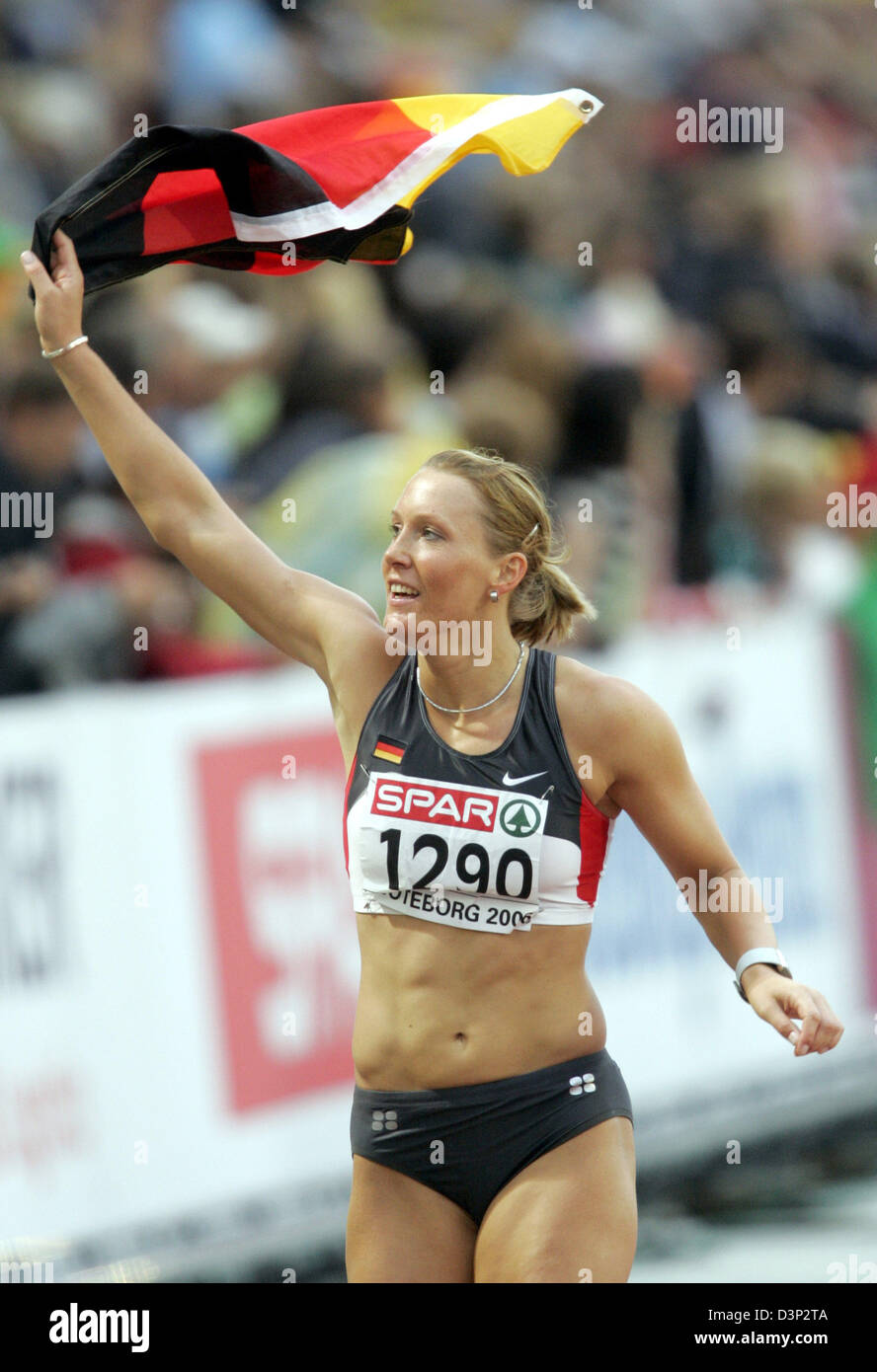 German athlete Kirsten Bolm does a lap of honour after her third place ...