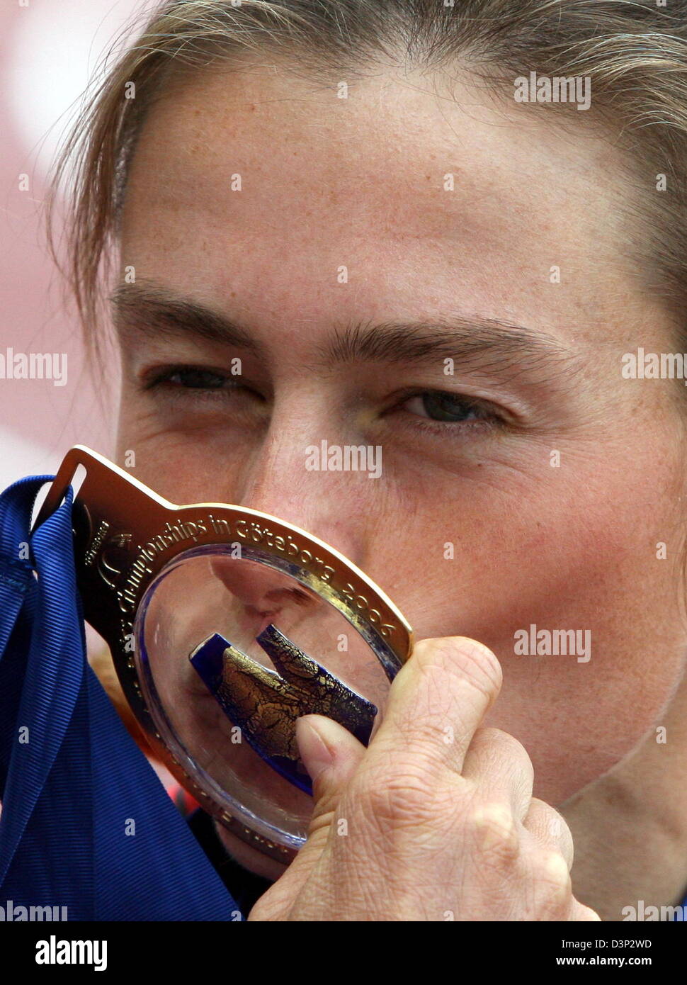 German Athlete Ulrike Maisch Kisses Marathon Gold Medal Of The 19th