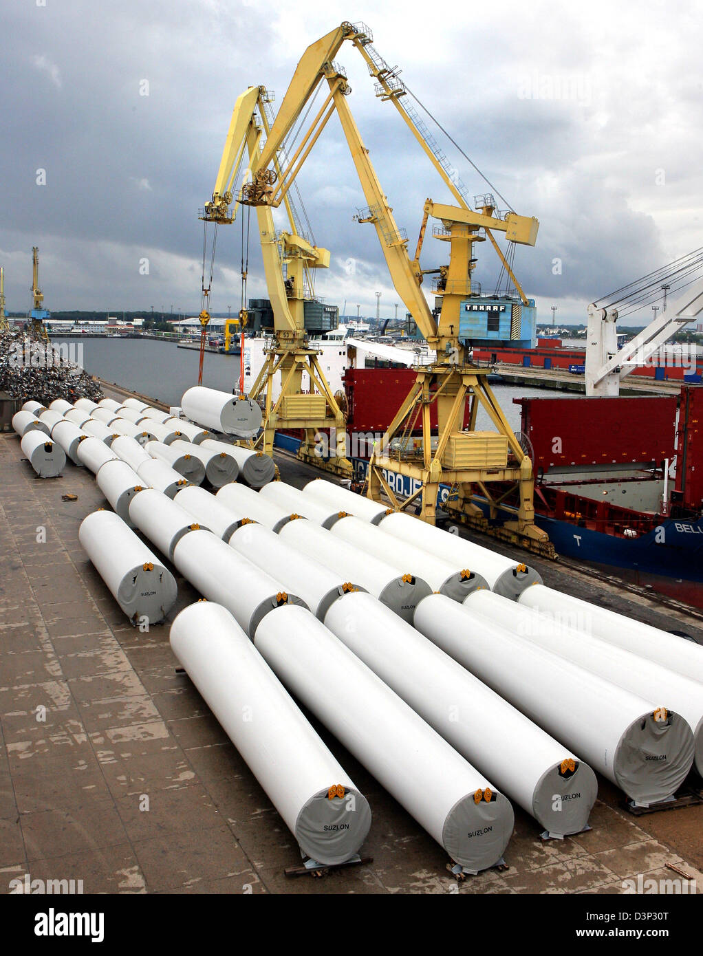 The picture shows segments of windmill towers that are being loaded on ...