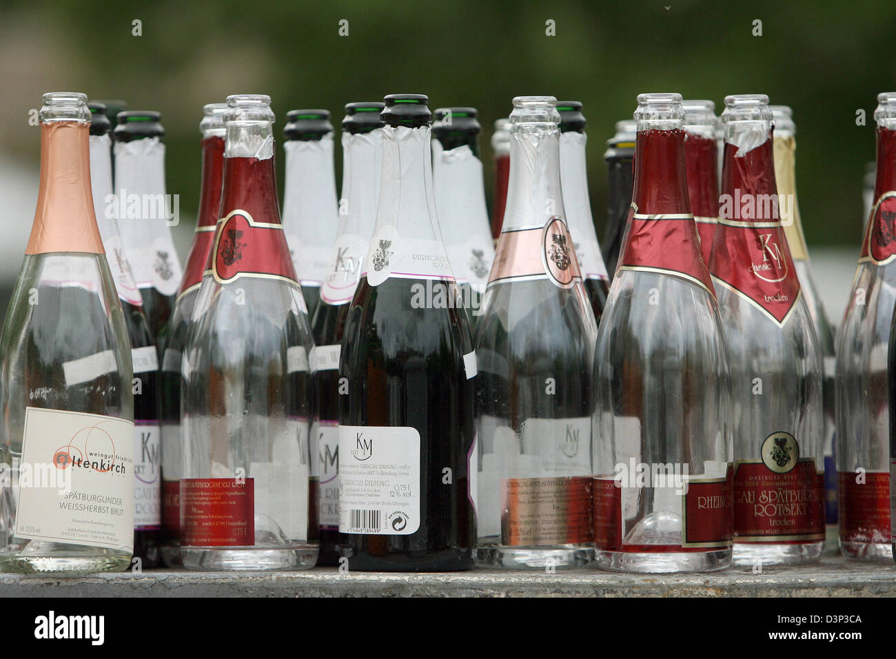 The picture shows empty alcohol-bottles on top of a bottle bank in ...