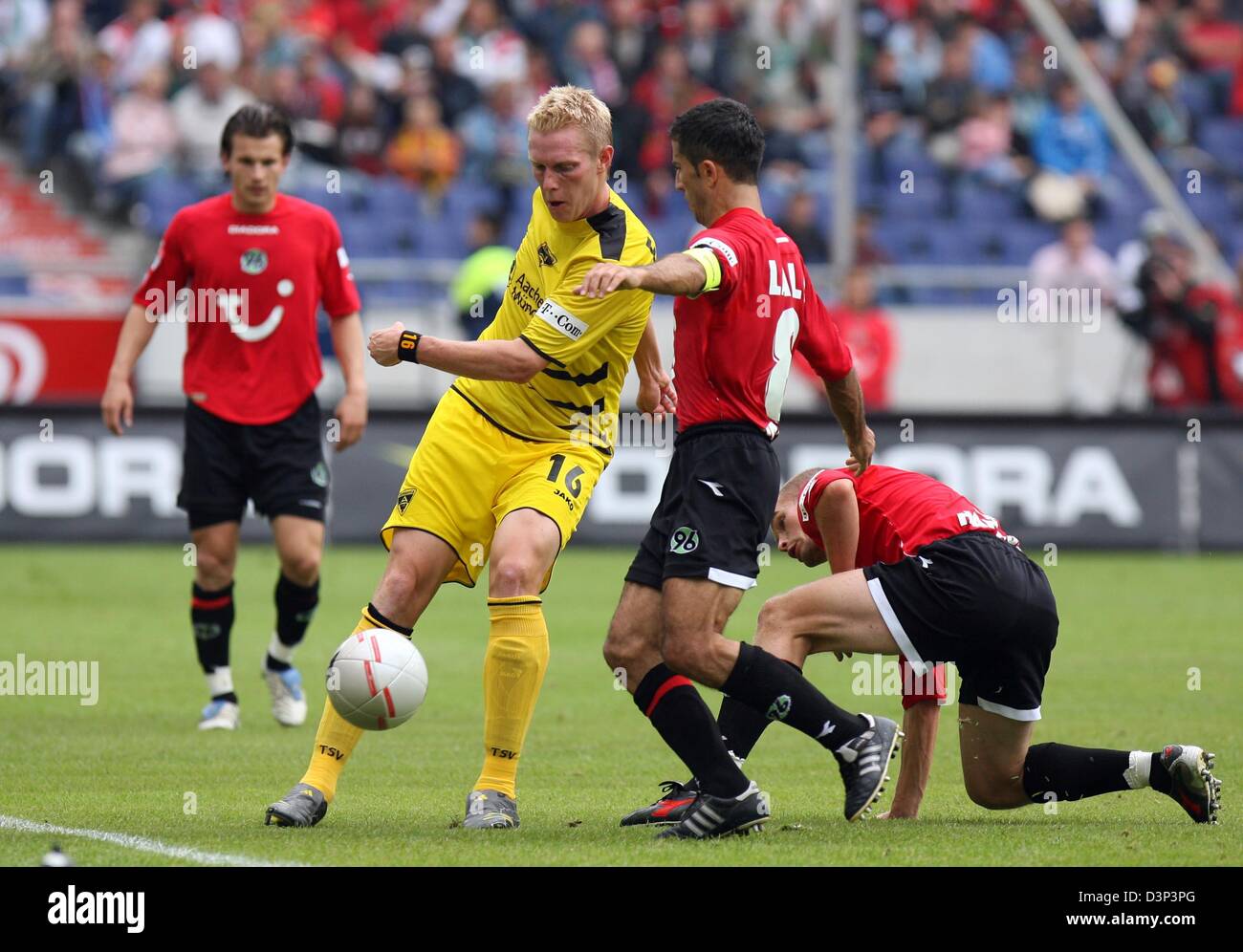 Altin Lala (R) of Hanover vies for the ball with Marius Ebbers of ...