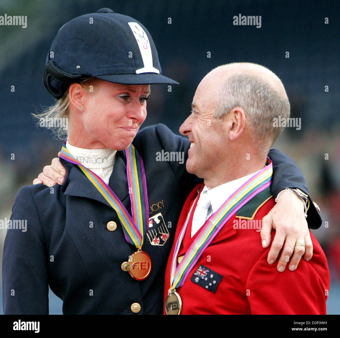 German Eventing team member Bettina Hoy (L) is happy about her medal ...