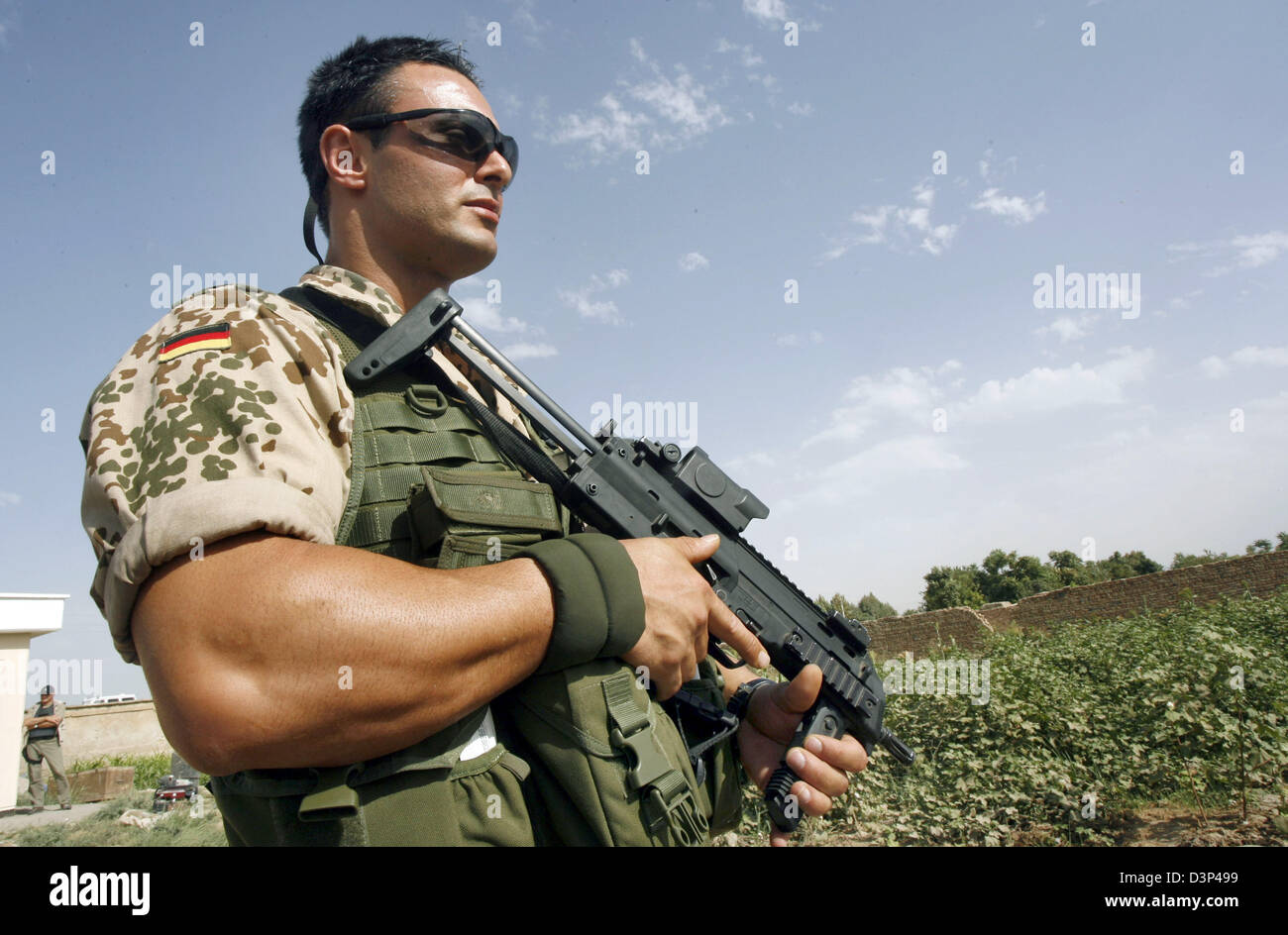 A German Bundeswehr soldier guards a military convoi in the provincial ...
