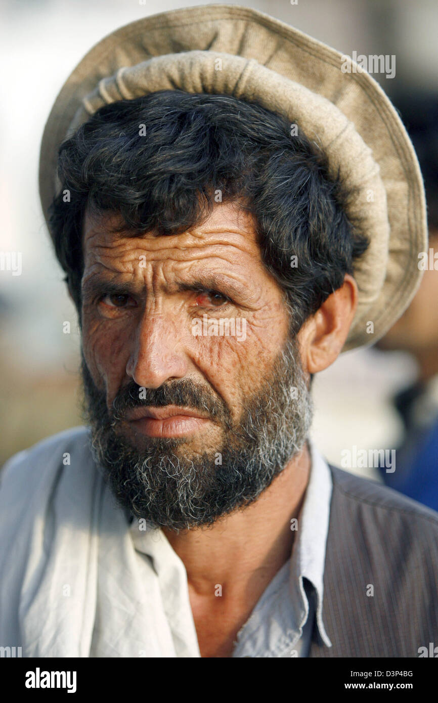 A man with beard photographed at the side of the road in Kabul ...