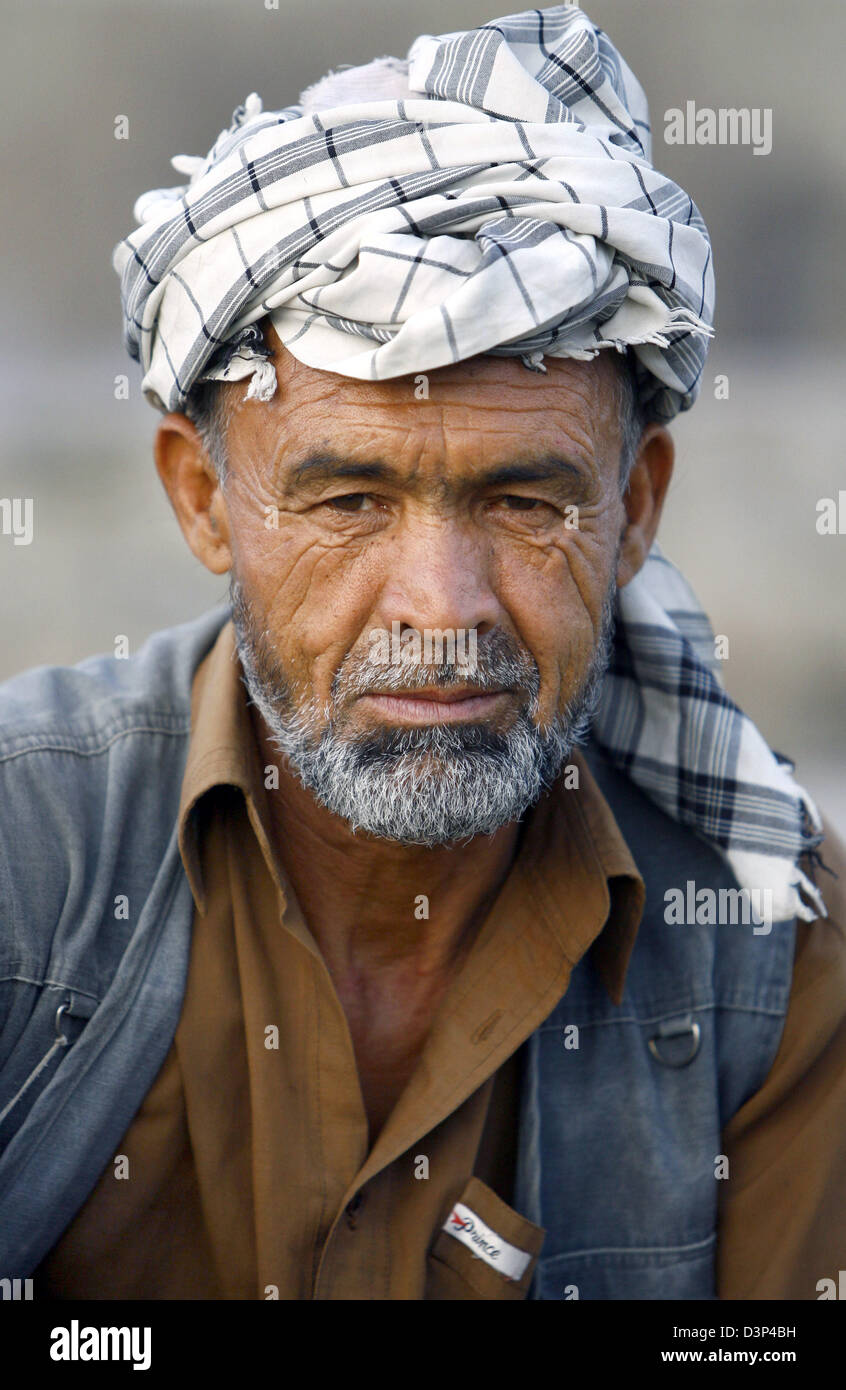 A man with beard and turban photographed at the side of the road in ...