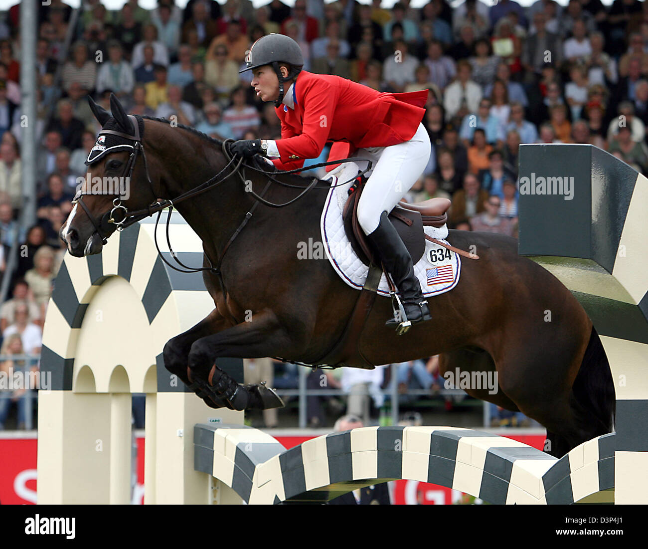 US show jumper Beezie Madden and her horse 'Authentic' take an obstacle ...
