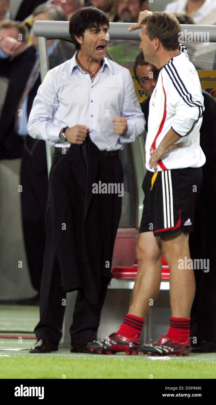 German head coach Joachim Loew (L) and goalie coach Andreas Koepke ...