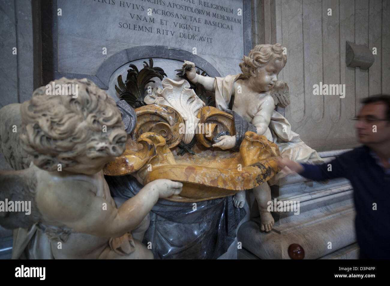 An elaborate font or stoup containing holy waterin St Peter's basilica ...