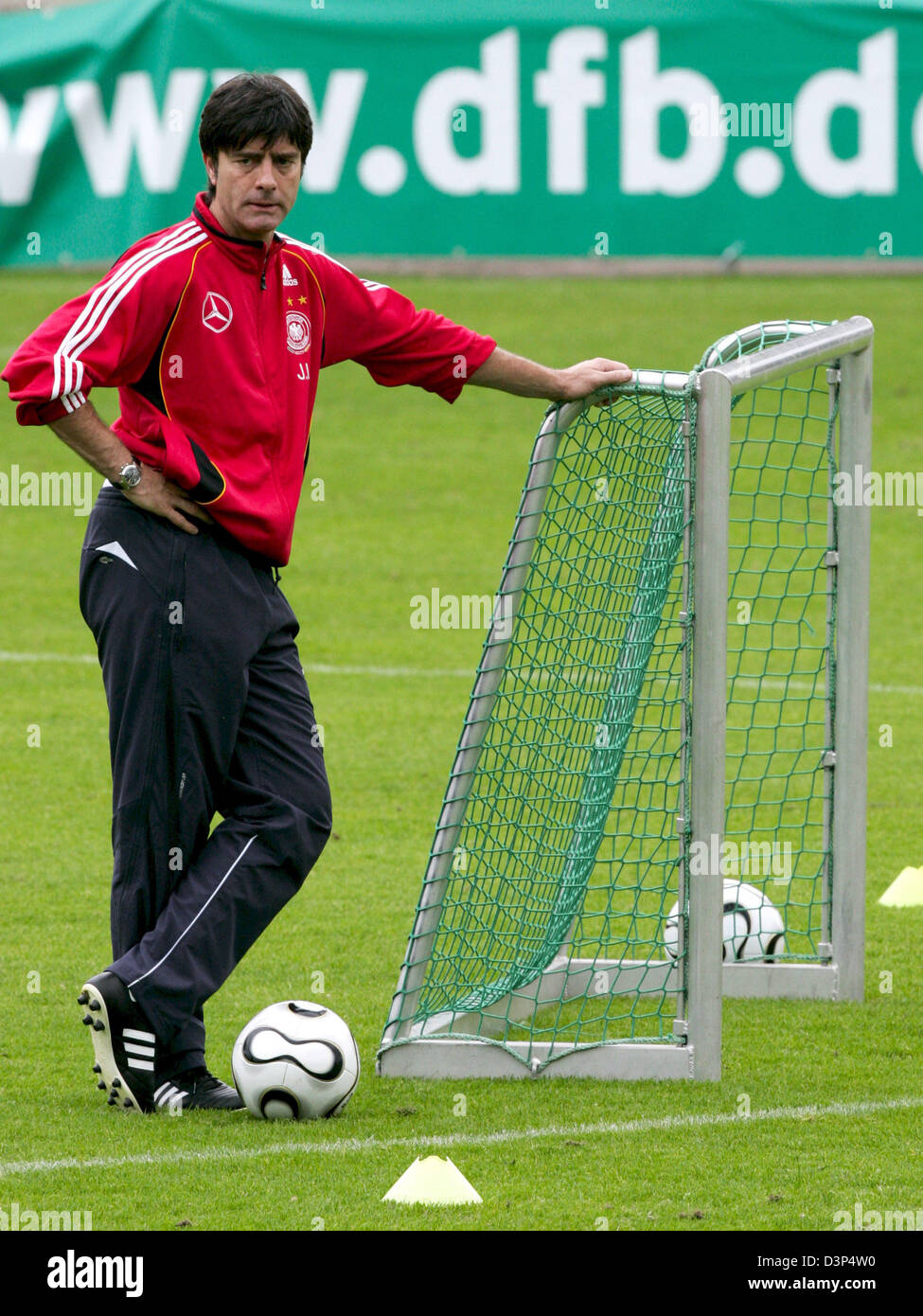Joachim Loew (R), the coach of the German national soccer team, leans ...