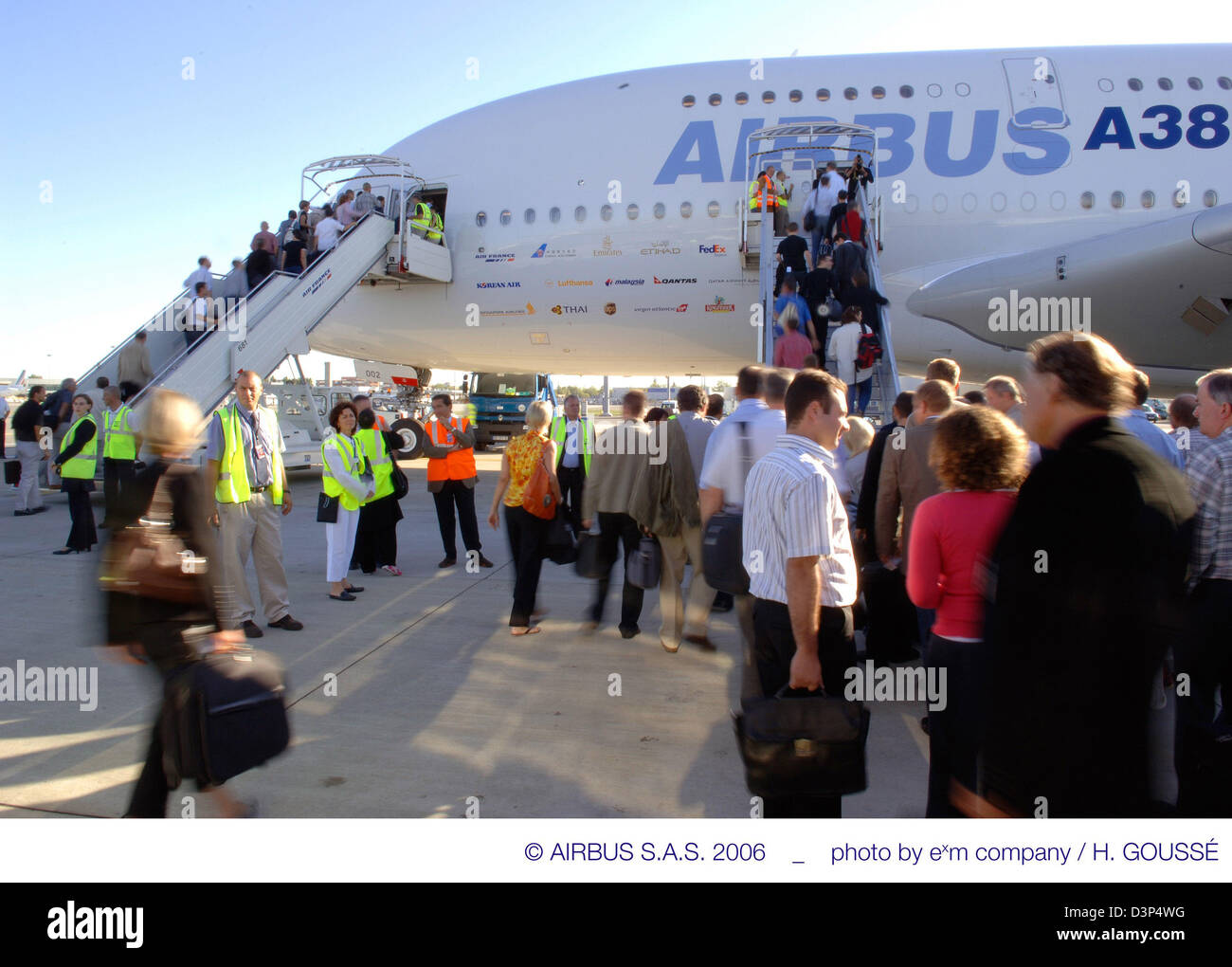 Test passengers stand in front of the Airbus A 380 in Toulouse, France ...