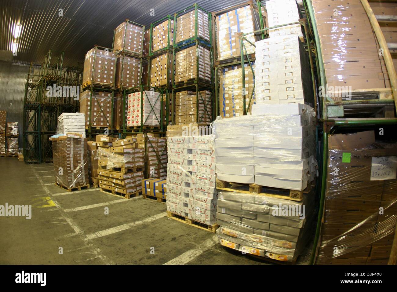 The photo shows palletised boxes in the cold storage house of a meat ...