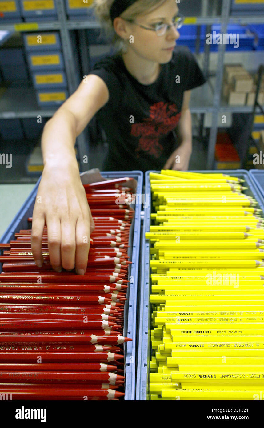 A woman grabs a handful of crayons in the fabric of pen producer Lyra ...
