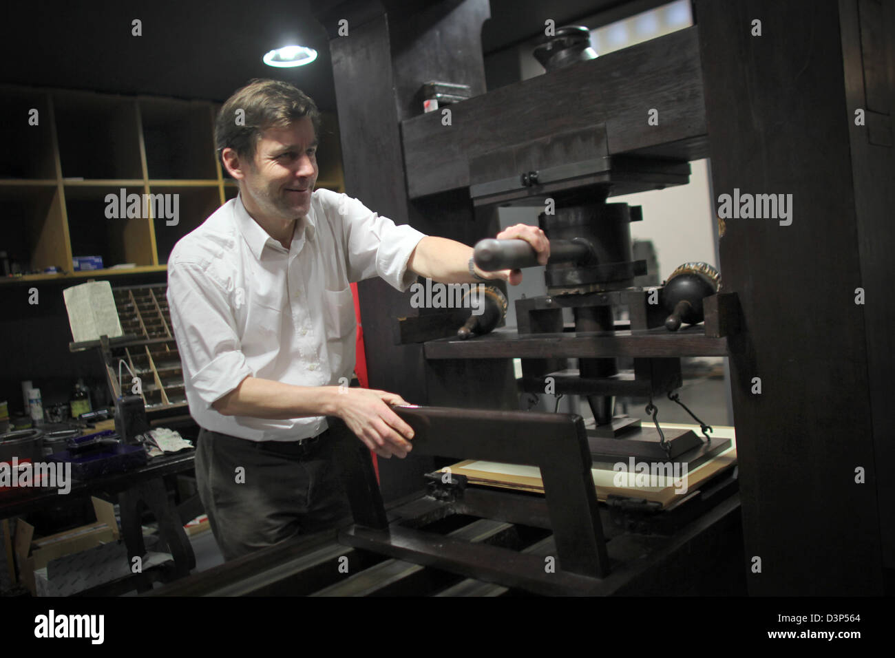 Swiss author Peter Stamm poses with a printing press at the Gutenberg ...