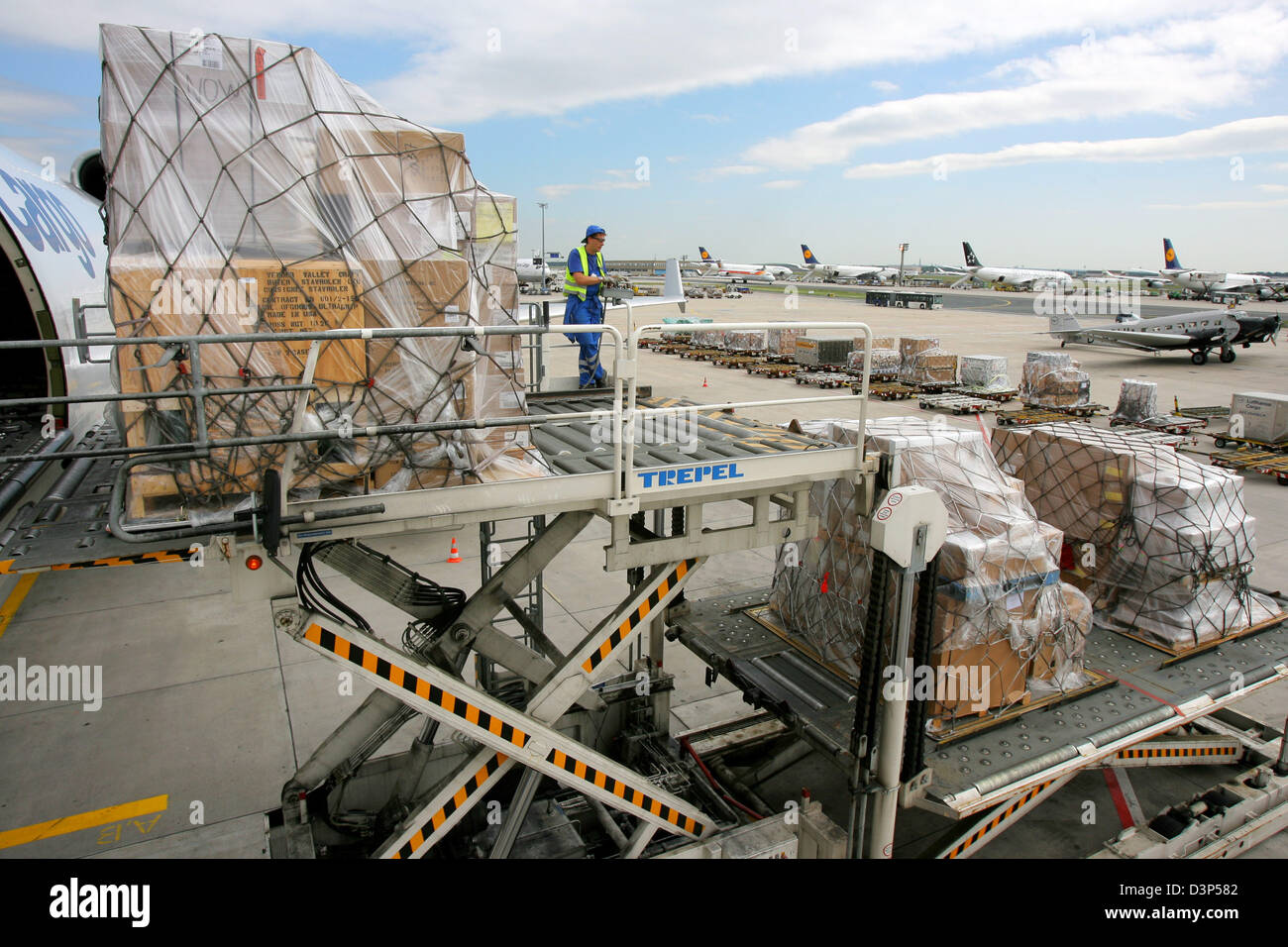 A Lufthansa Cargo employee loads a MD-11 air freighter at the cargo ...