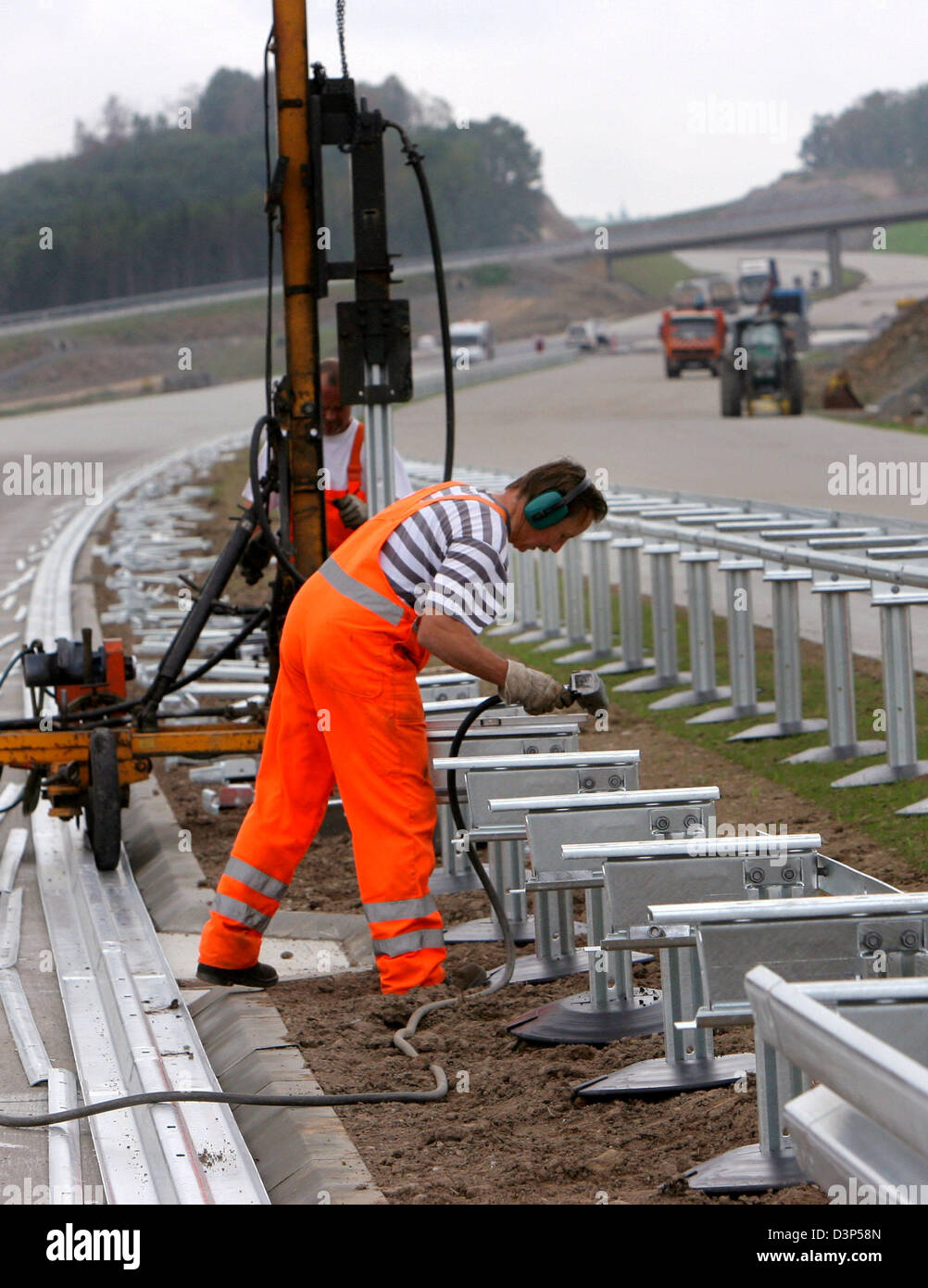 Construction workers mount crash barriers near Pirna, Germany ...