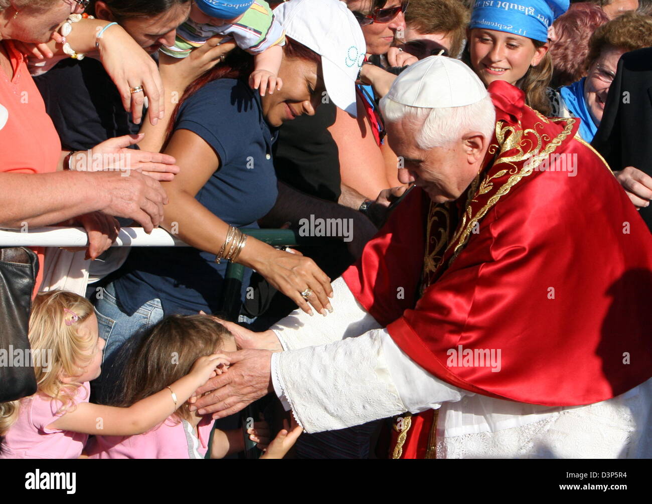 Pope Benedict XVI shakes hands with the faithful in Altoetting, Germany ...
