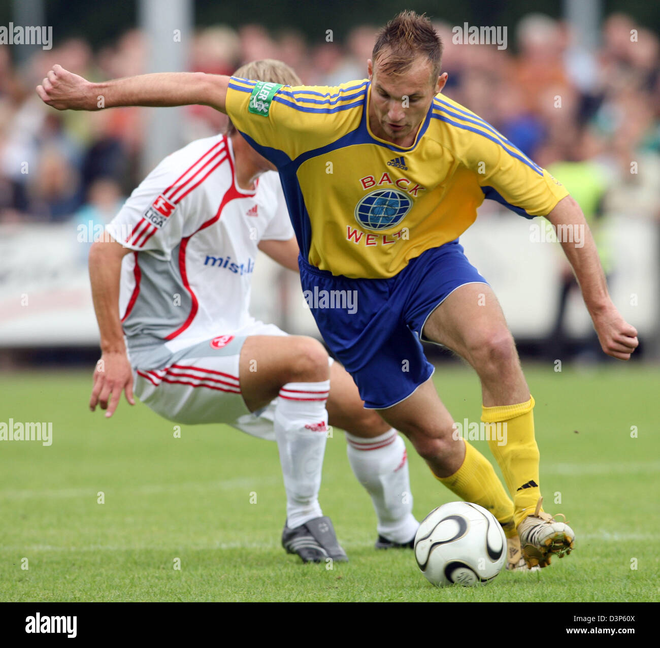 Cloppenburg's Juerg Uwe Kluetz (R) and Nuremberg's Dominik Reinhardt ...