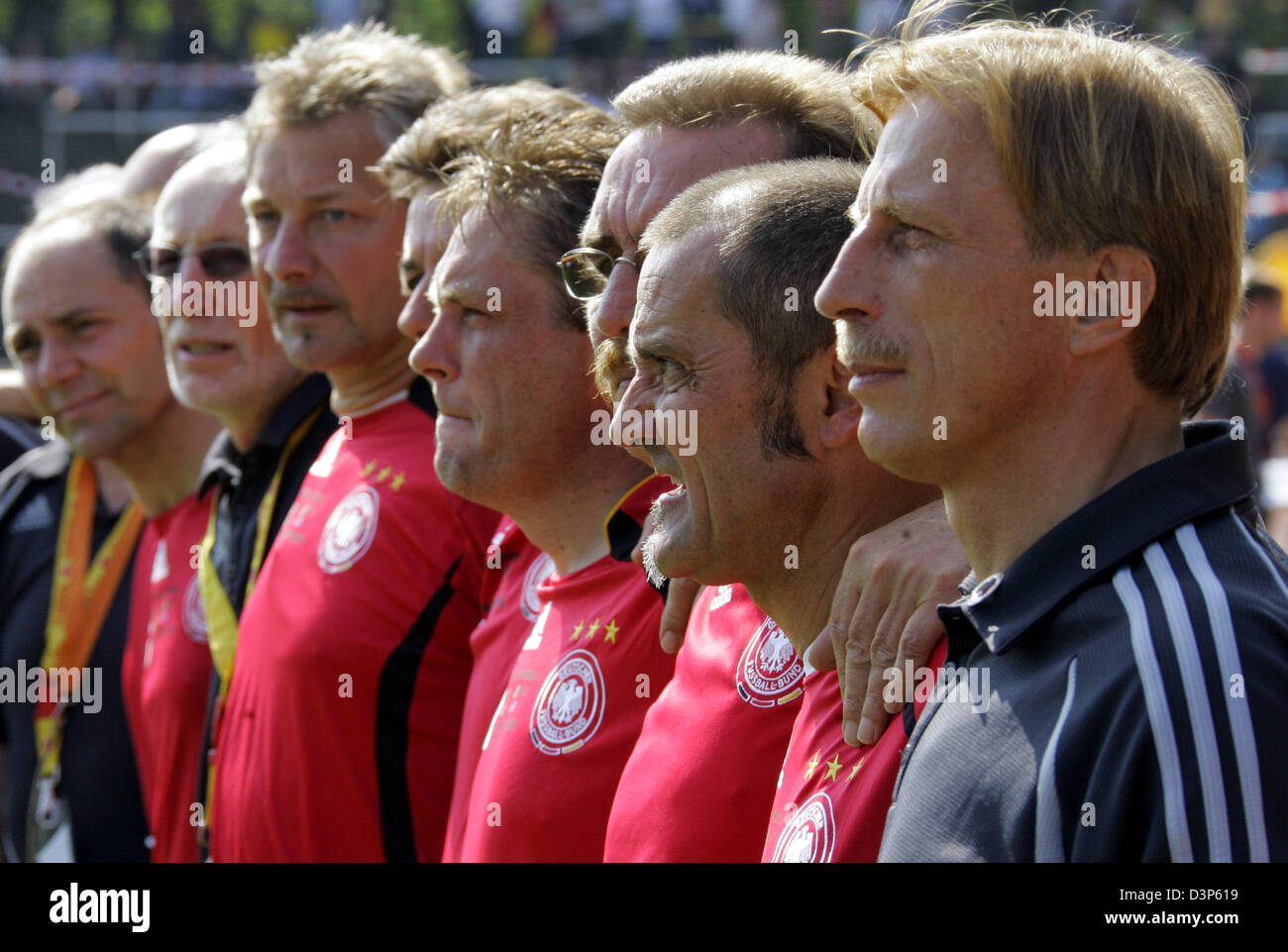 The German coaches listen to the national anthem before the kick-off of ...