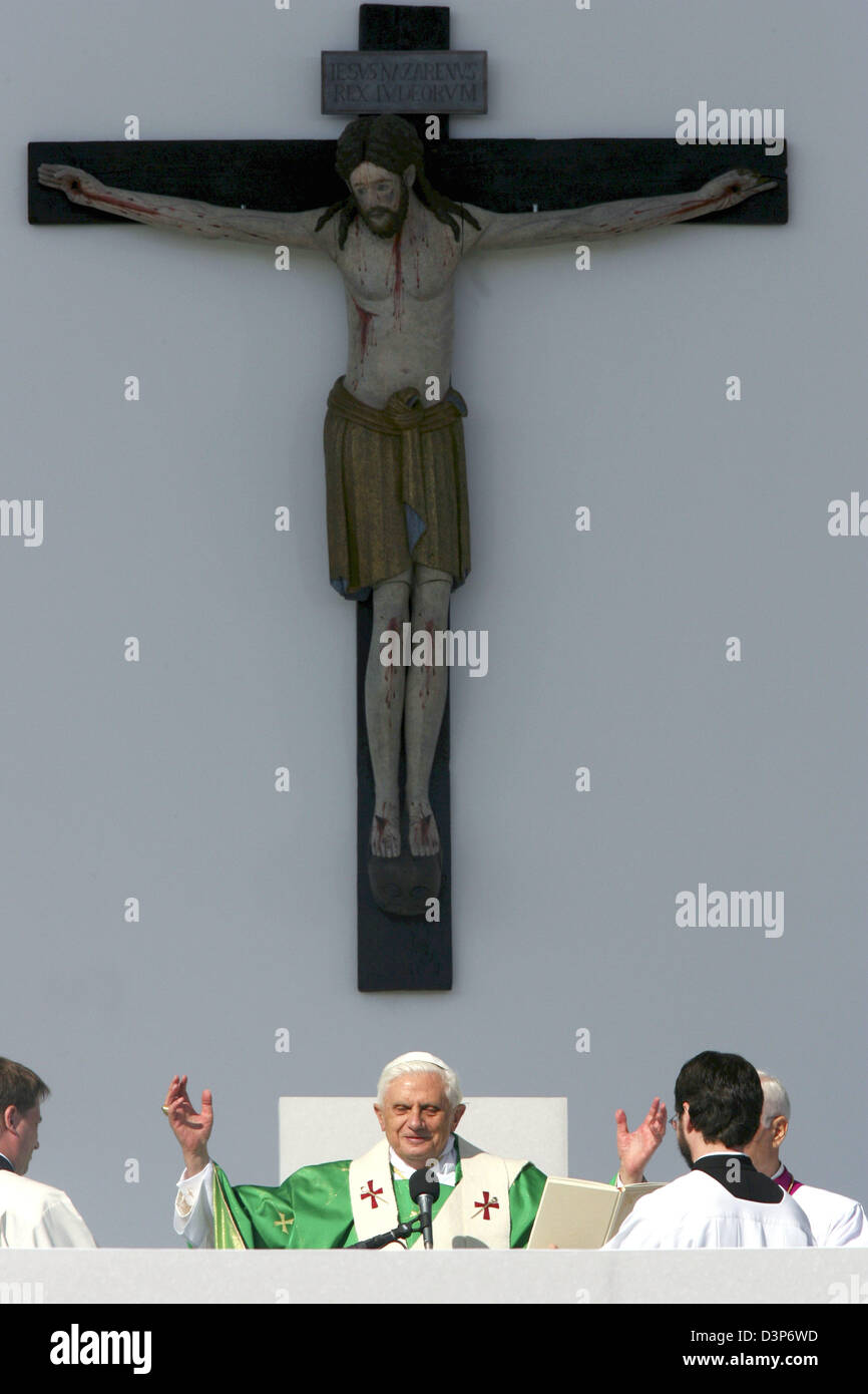 Pope Benedict XVI spreads his arms on the altar stage during his open ...