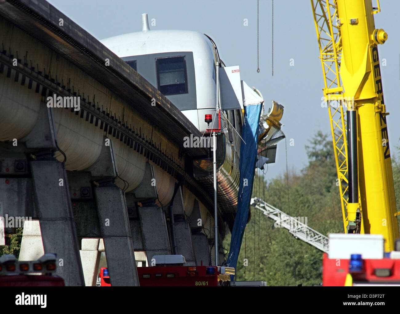 A damaged 'Transrapid' maglev train stands next to a crane at the test ...