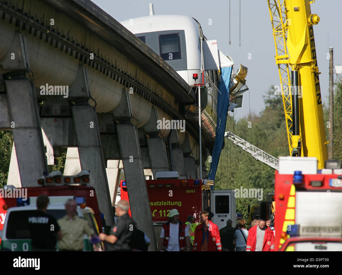 A damaged 'Transrapid' maglev train stands next to a crane at the test ...