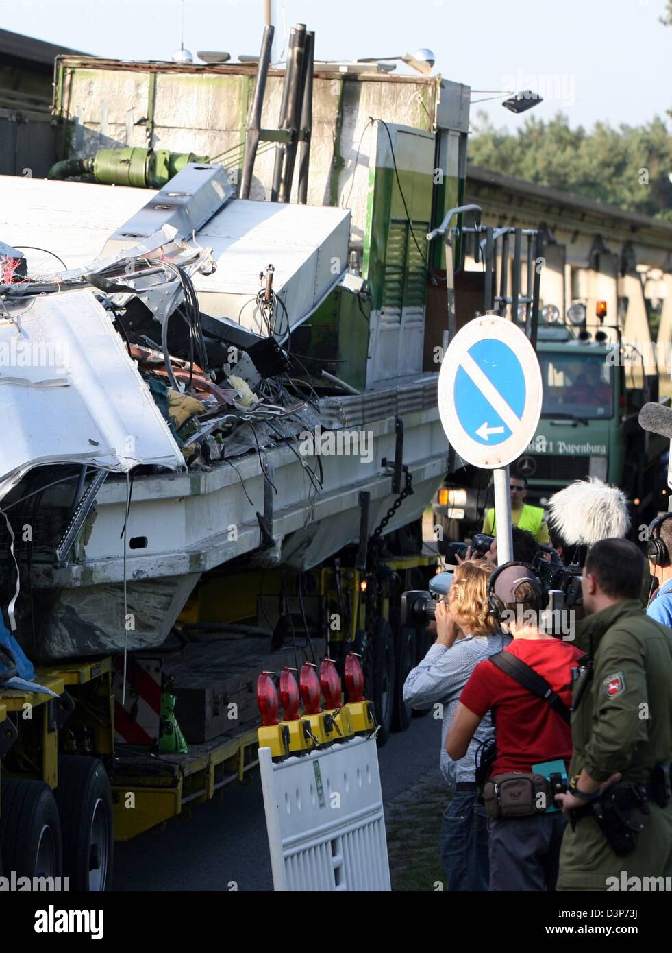 Debris of the maintenance vehicle are removed from the accident scene ...