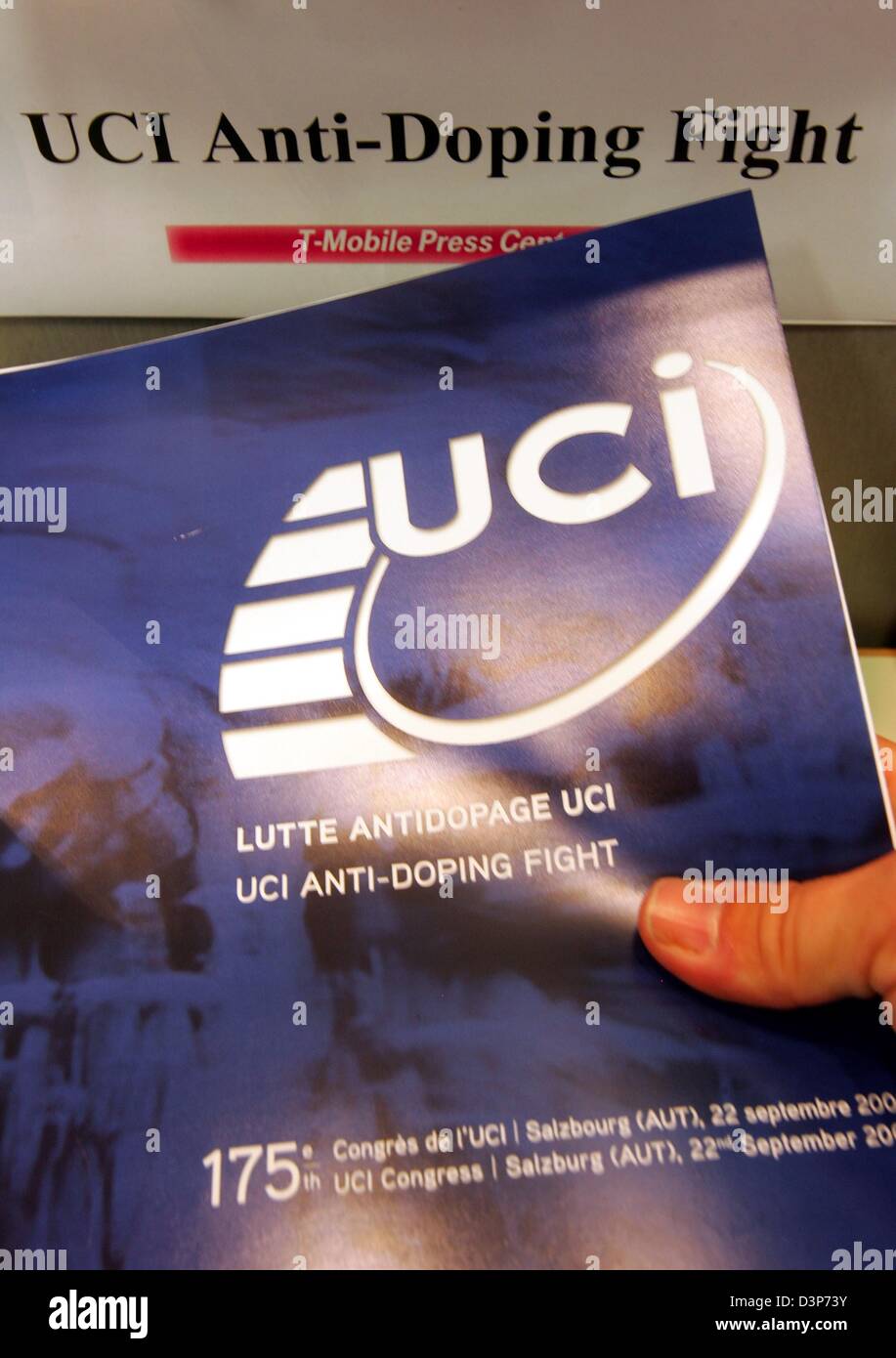 A journalist holds a UCI anti-doping guide book in his hands at the the ...