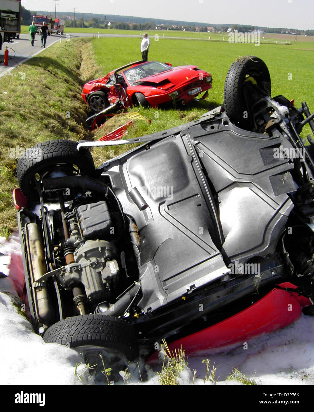 A crashed Ferrari (background) and a crashed Smart (front) pictured at ...